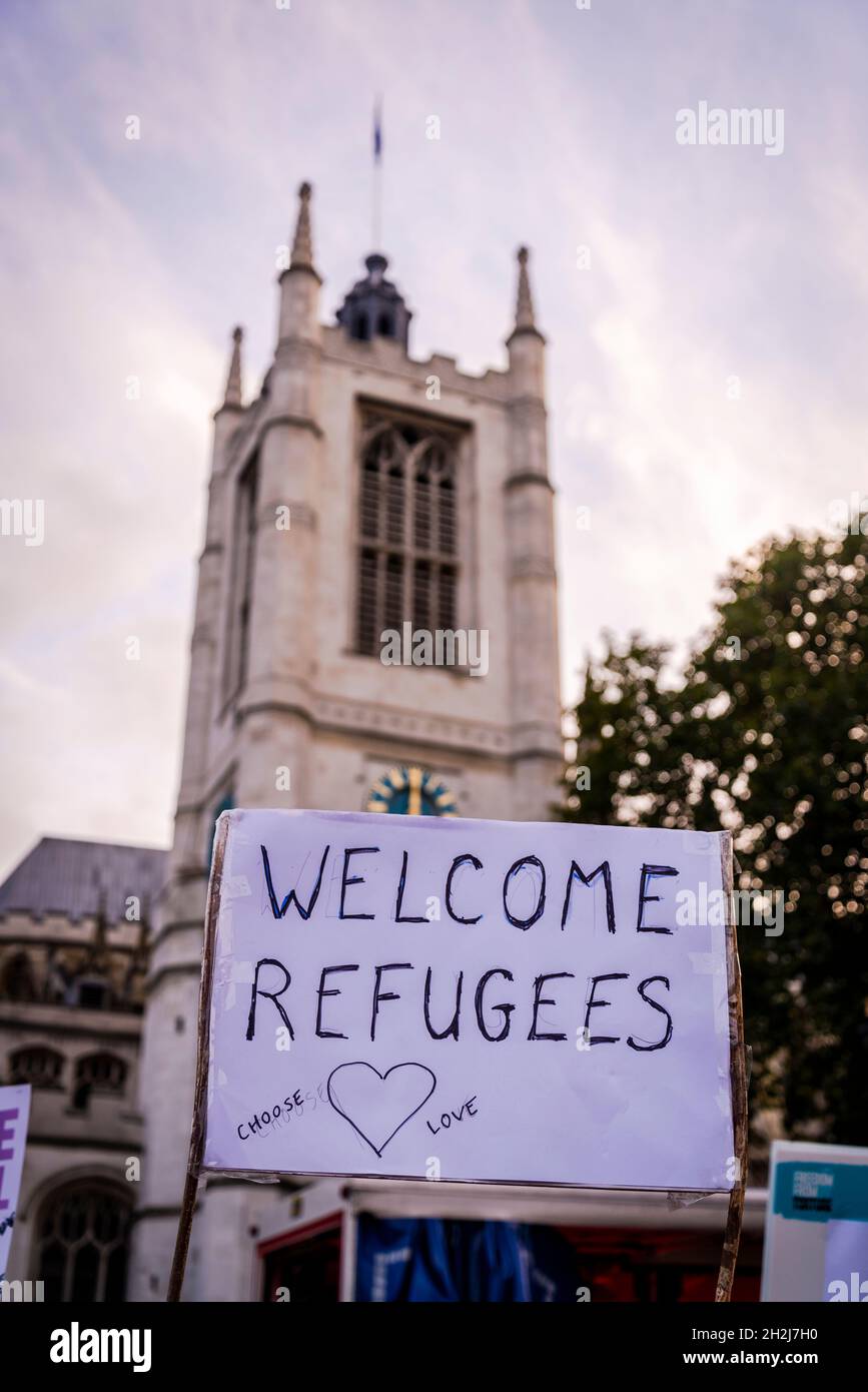 Welcome refugees placard with Westminster Abbey tower in background ...