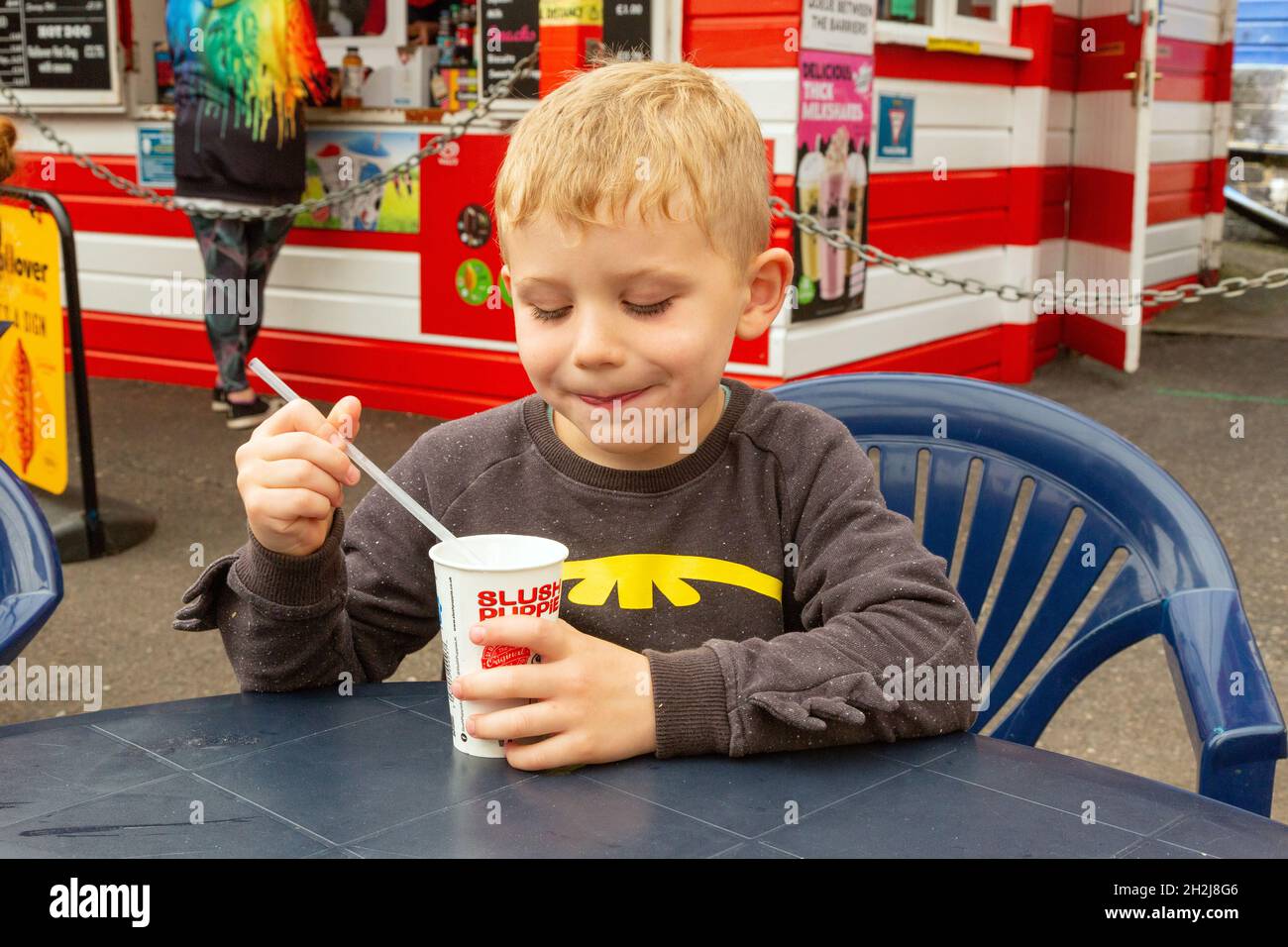 Four year old boy with a slushy at Woodlands family theme park, Totnes ...