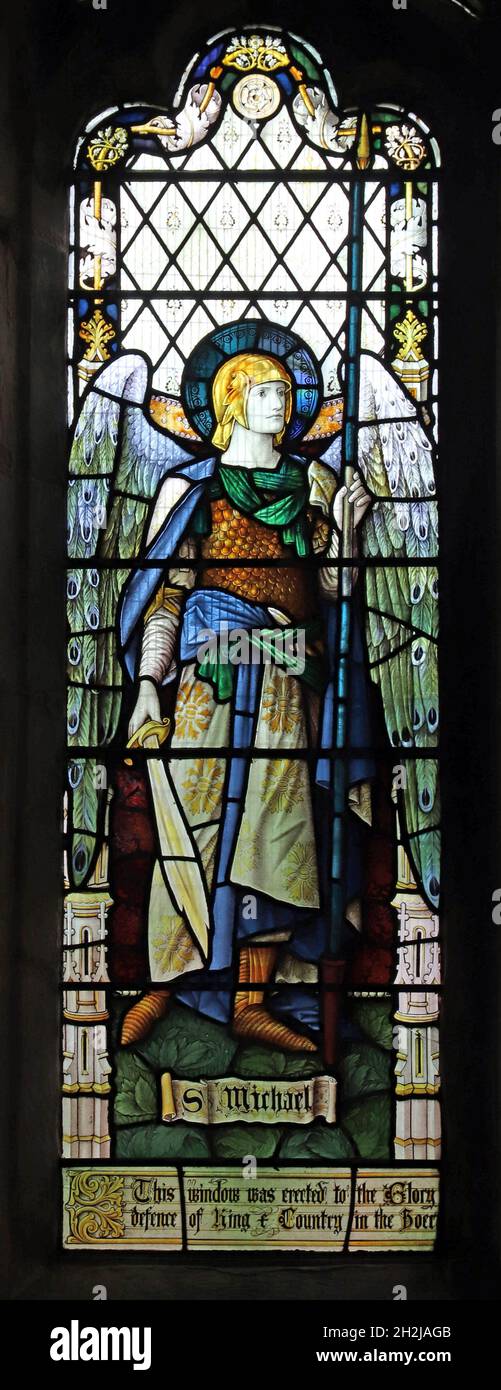 A stained glass window by Shrigley & Hunt depicting Saint Michael, St ...