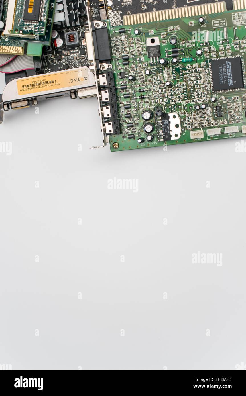 electronic devices integrated circuit boards piled up on a white ...
