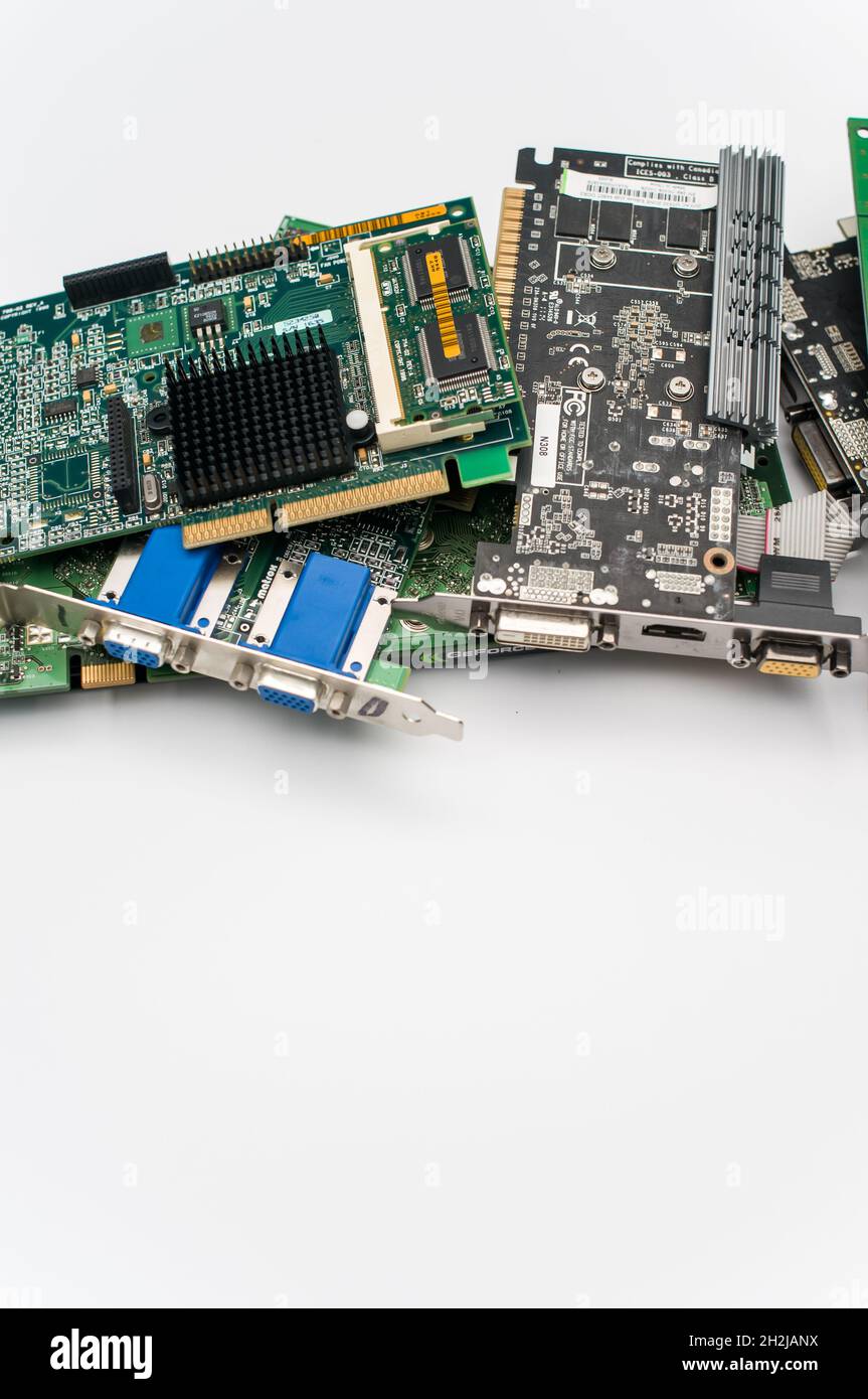 electronic devices integrated circuit boards piled up on a white ...
