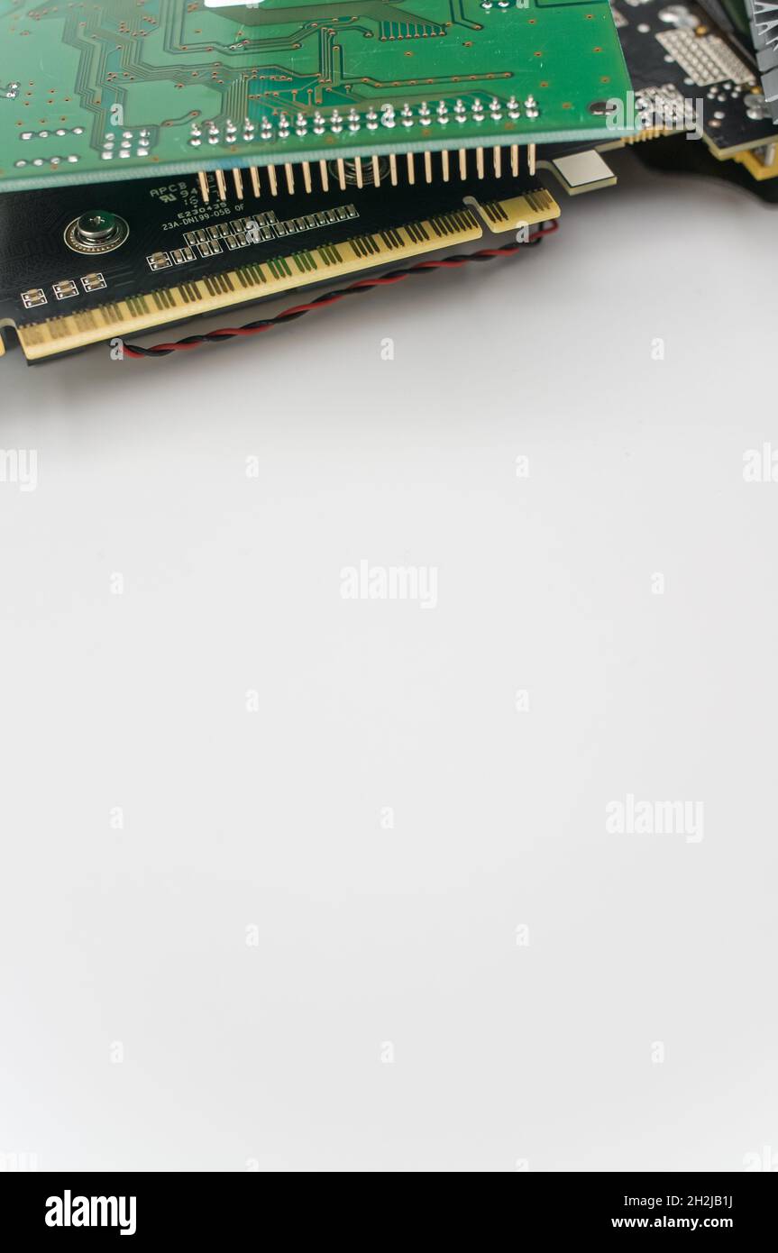 electronic devices integrated circuit boards piled up on a white ...