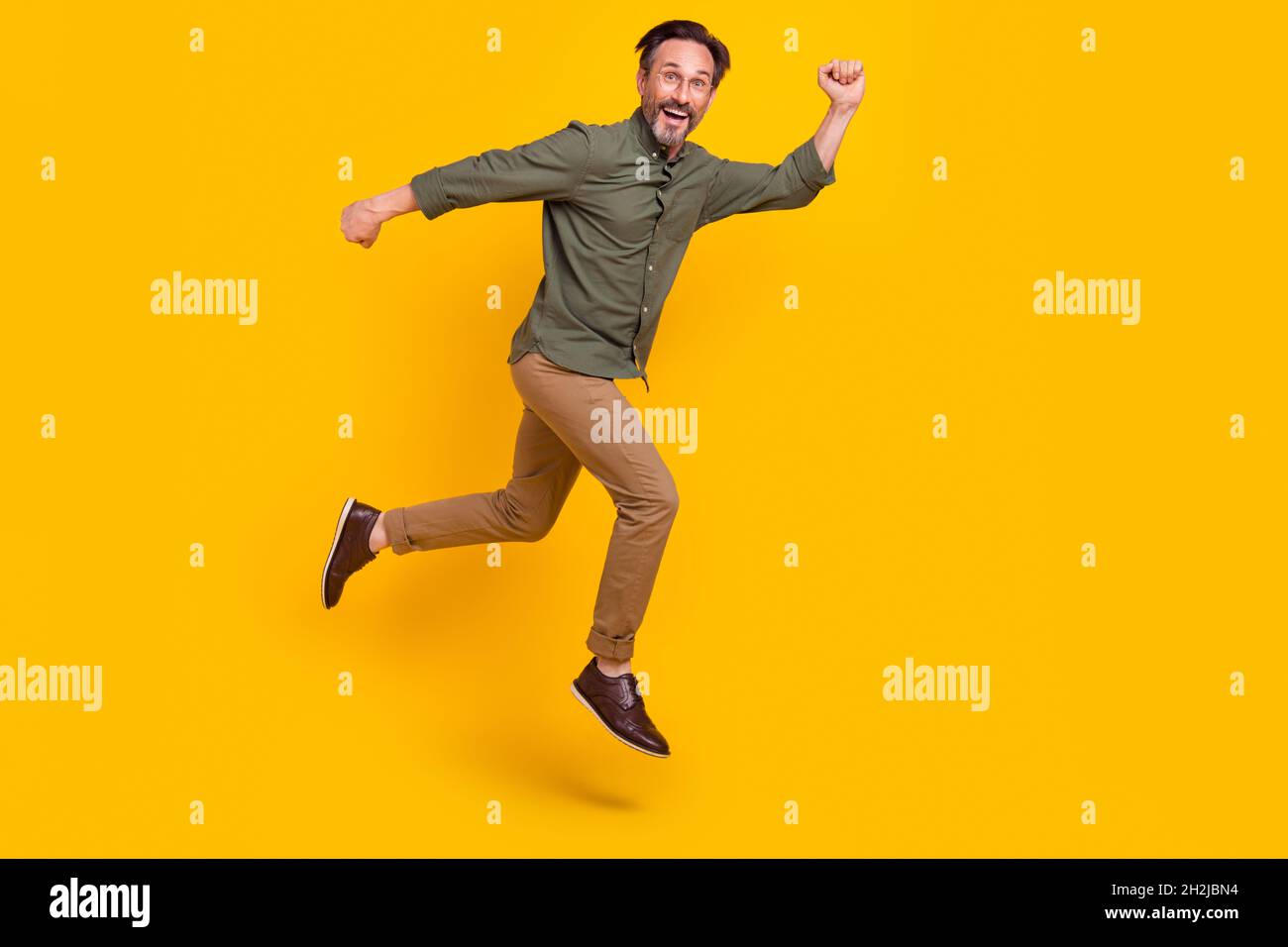 Full length body size view of attractive cheery lucky man jumping going ...