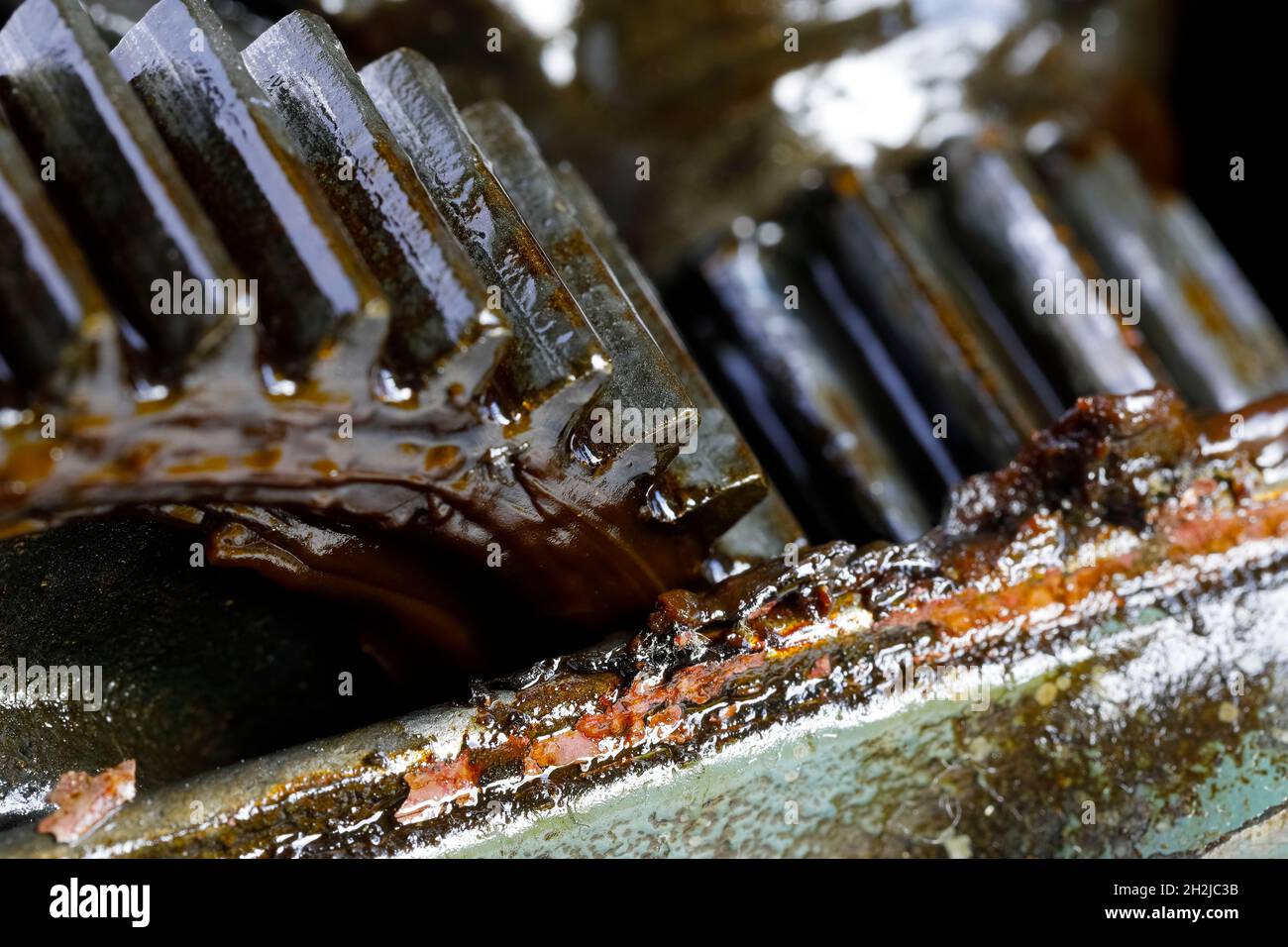 Worn grease can be seen inside the cog wheels unit. This is a partial ...