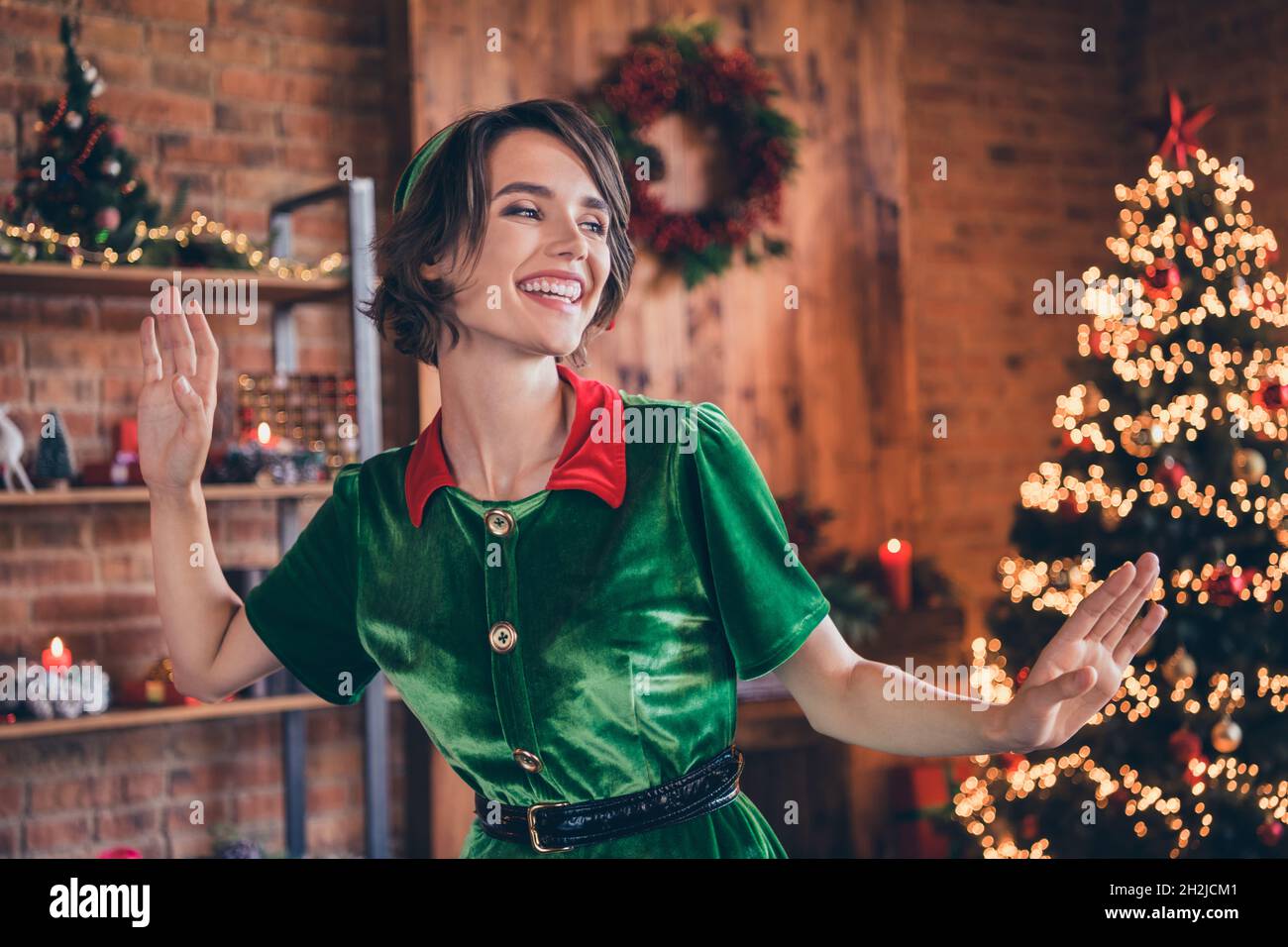 Photo of funny charming young lady wear elf clothes dancing celebrating ...