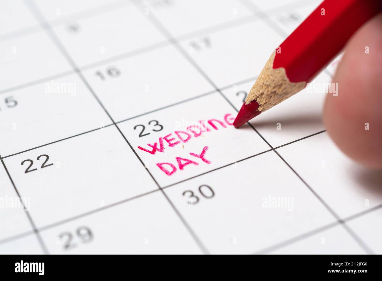 Persona marks out the date on the calendar as a reminder of the wedding ...
