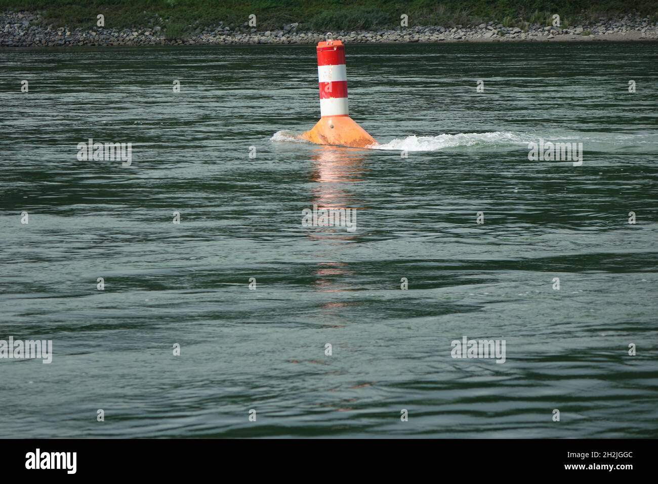 Red and white buoy marking the Rhine fairway between Plittersdorf ...