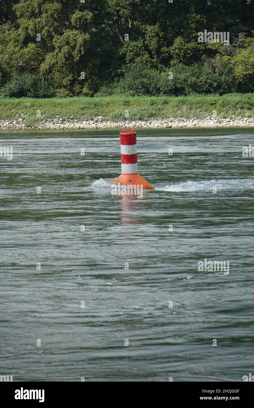 Red and white buoy marking the Rhine fairway between Plittersdorf ...