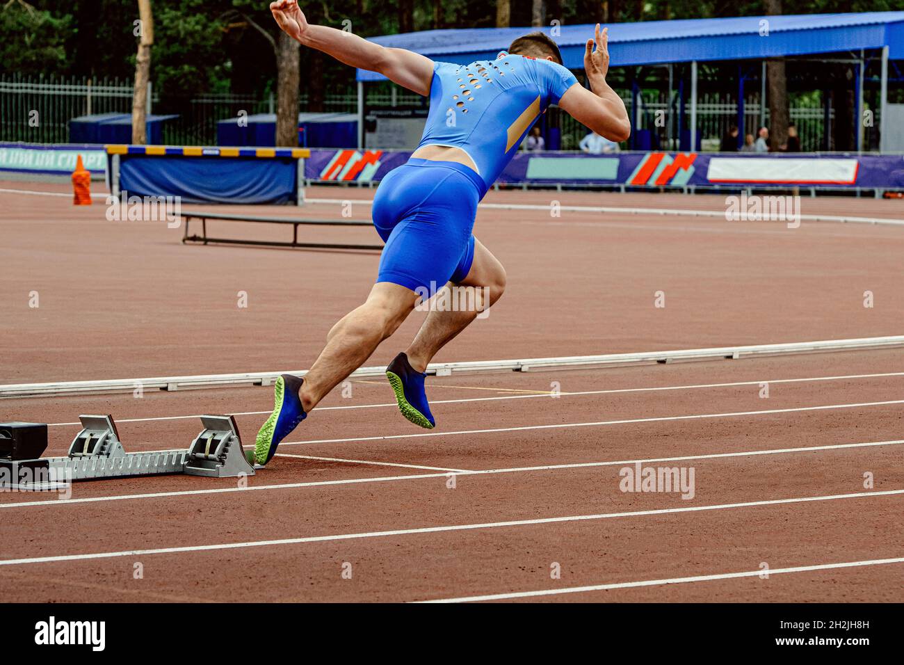 Male sprinter in blocks hi-res stock photography and images - Alamy
