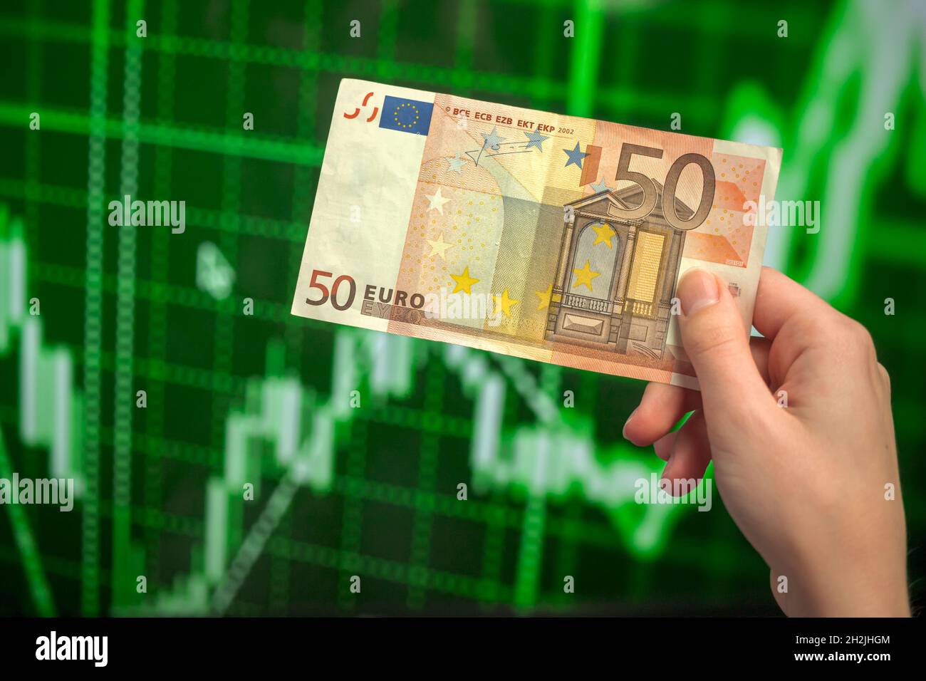 Euro EU banknote on a green stock chart background with dynamics of ...