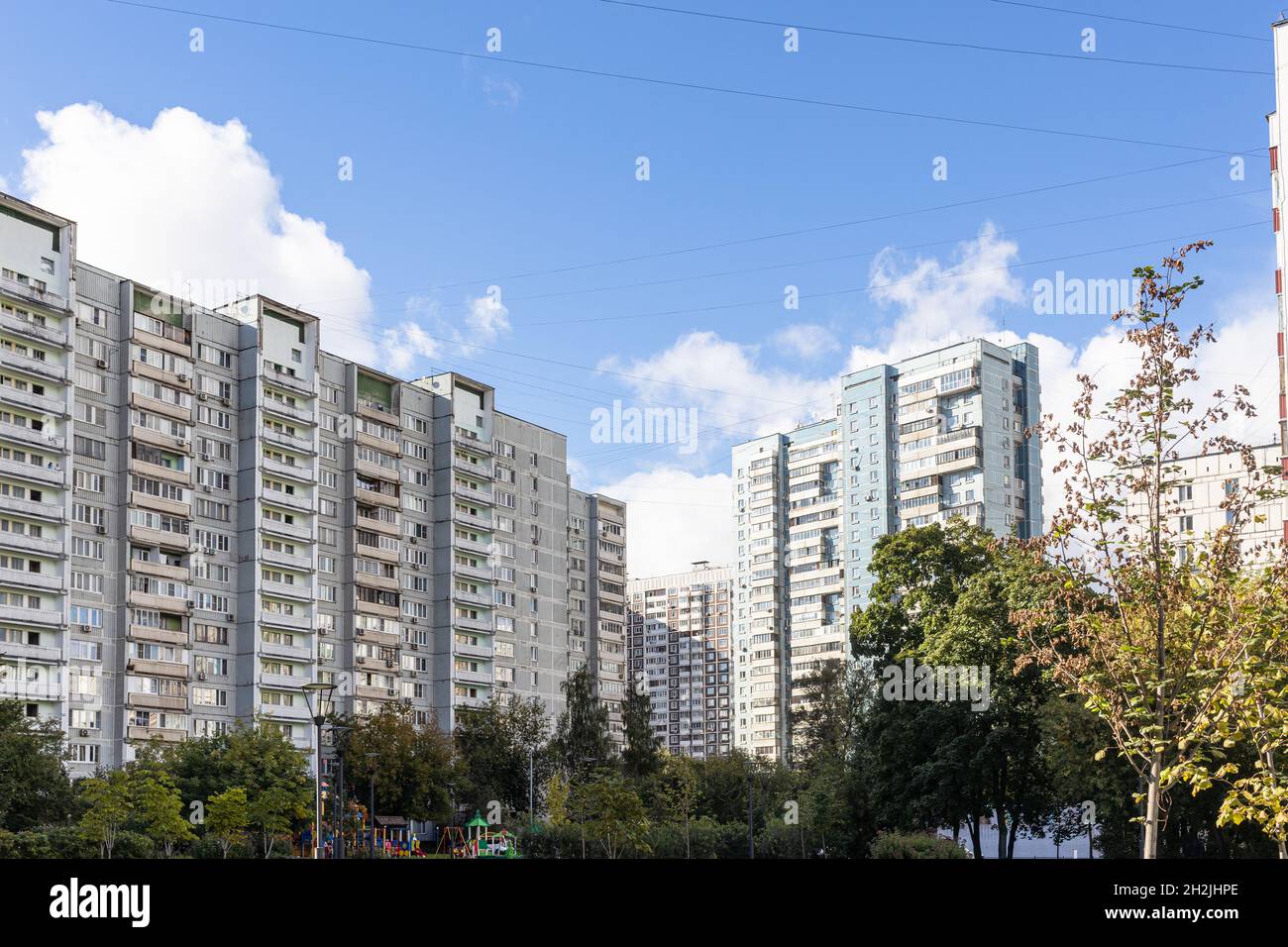 municipal high-rise apartment houses under blue sky in Moscow city on ...