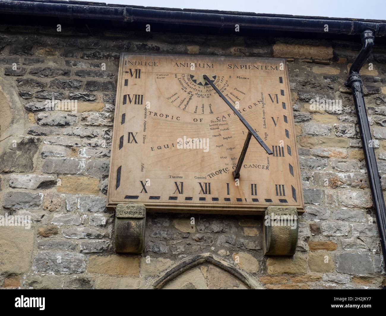 Wall mounted 18th century sundial above an entrance to St Lawrence ...