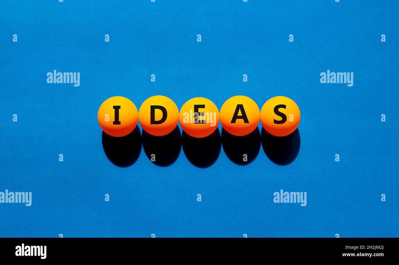Ideas symbol. The concept word 'ideas' on wooden cubes on orange table ...