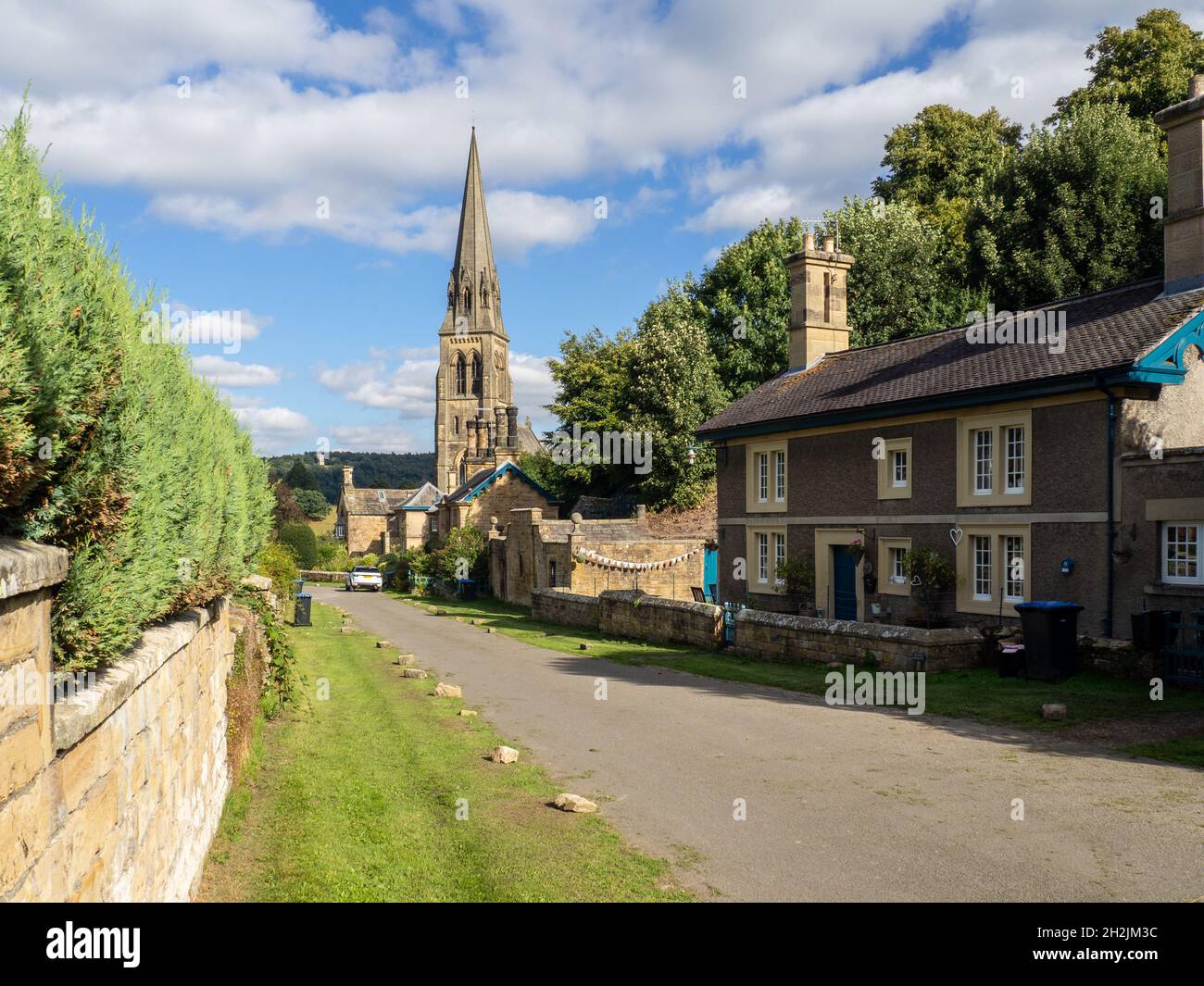 Street scene in summer in the estate village of Edensor, Derbyshire, UK ...