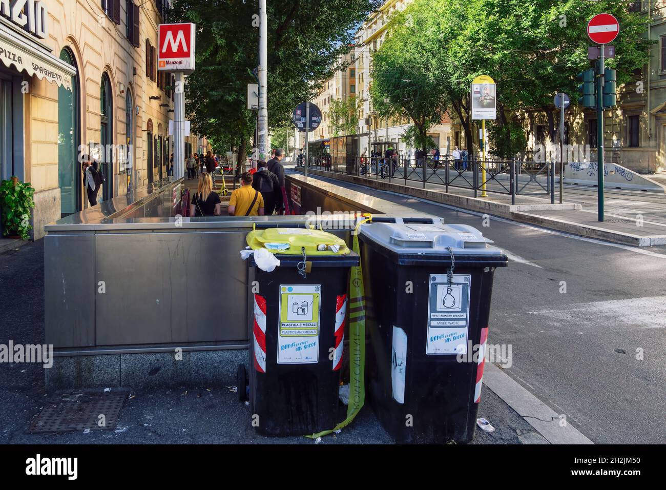 Rome, Italy garbage bins full of litter with chain locks. Dumpsters ...
