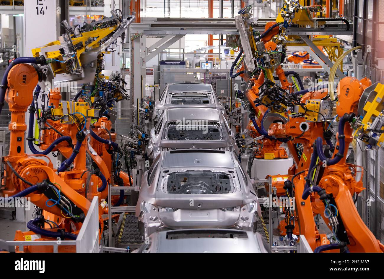 Munich, Germany. 22nd Oct, 2021. Robots work on the bodywork of various ...