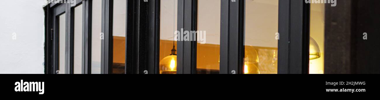 Black alloy folding door aluminium window frame banner Stock Photo - Alamy