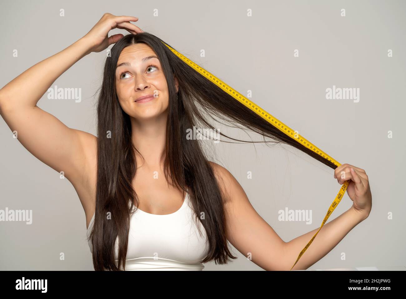 Woman with tape measure face hi-res stock photography and images - Alamy
