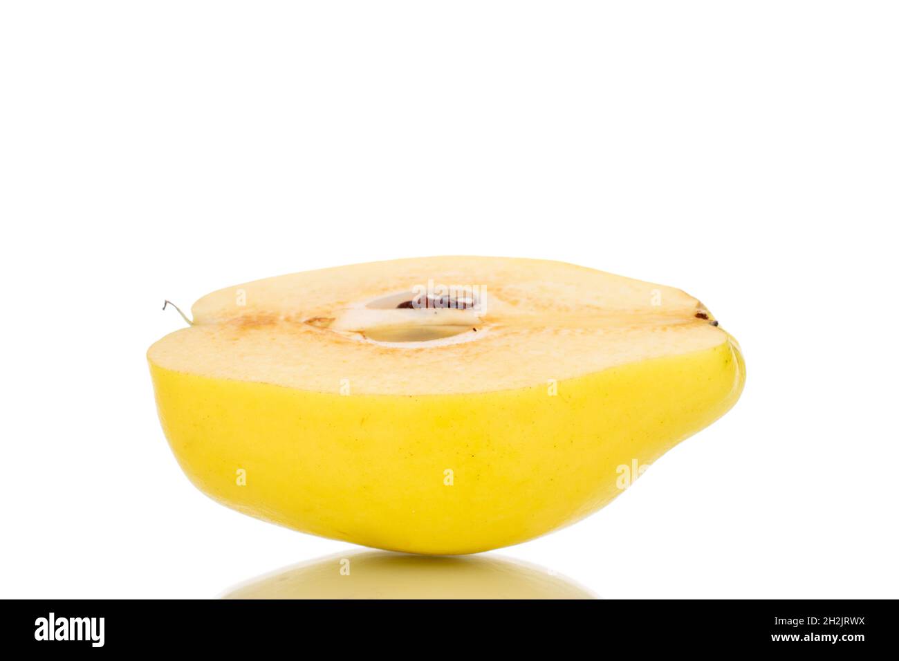 One half of ripe organic quince, close-up isolated on white Stock Photo ...