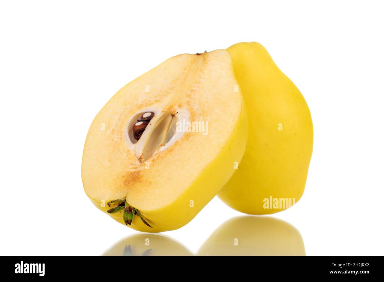Two half ripe organic quince, close-up, isolated on white Stock Photo ...