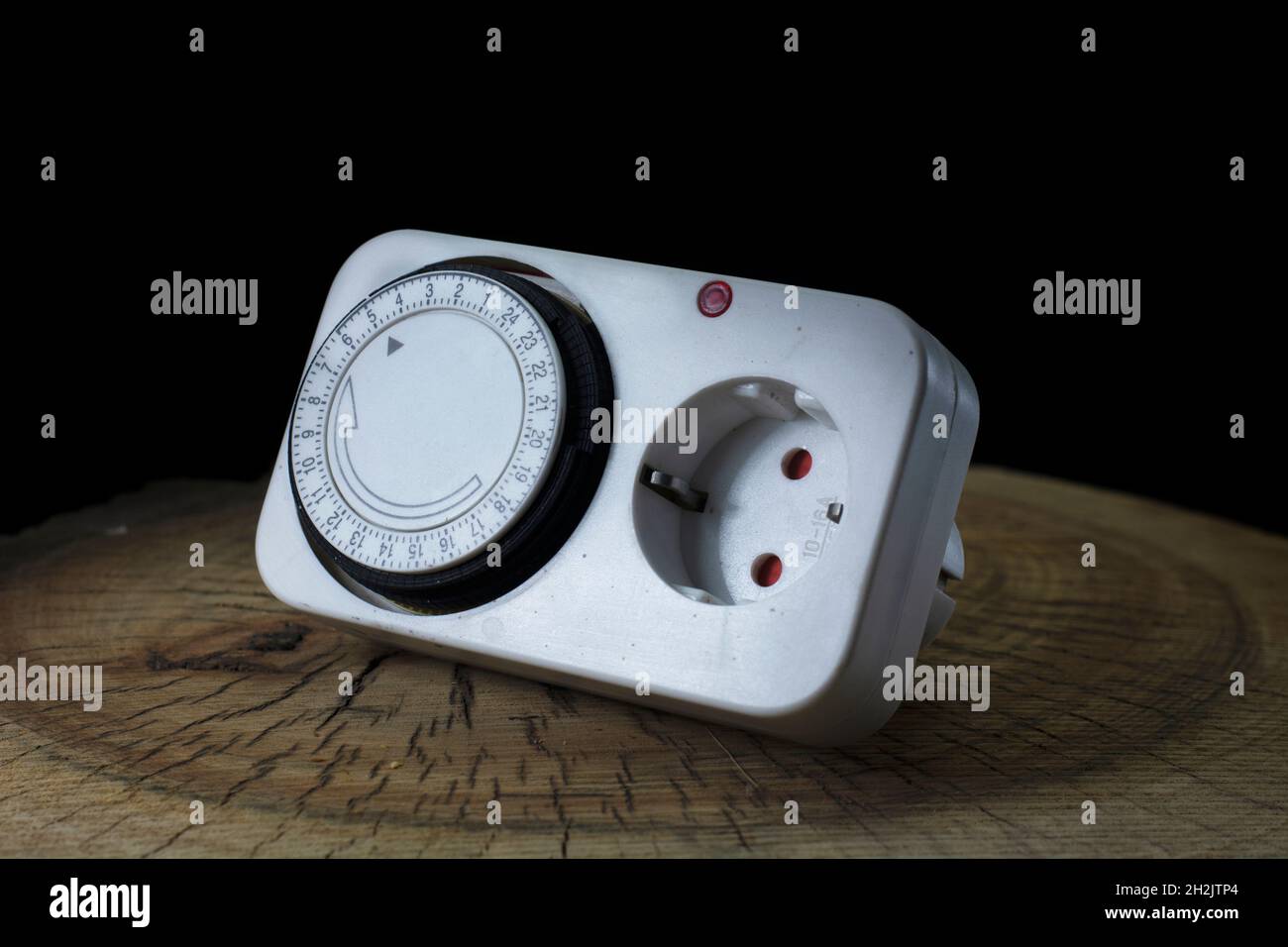 electrical control plug on wooden table Stock Photo - Alamy