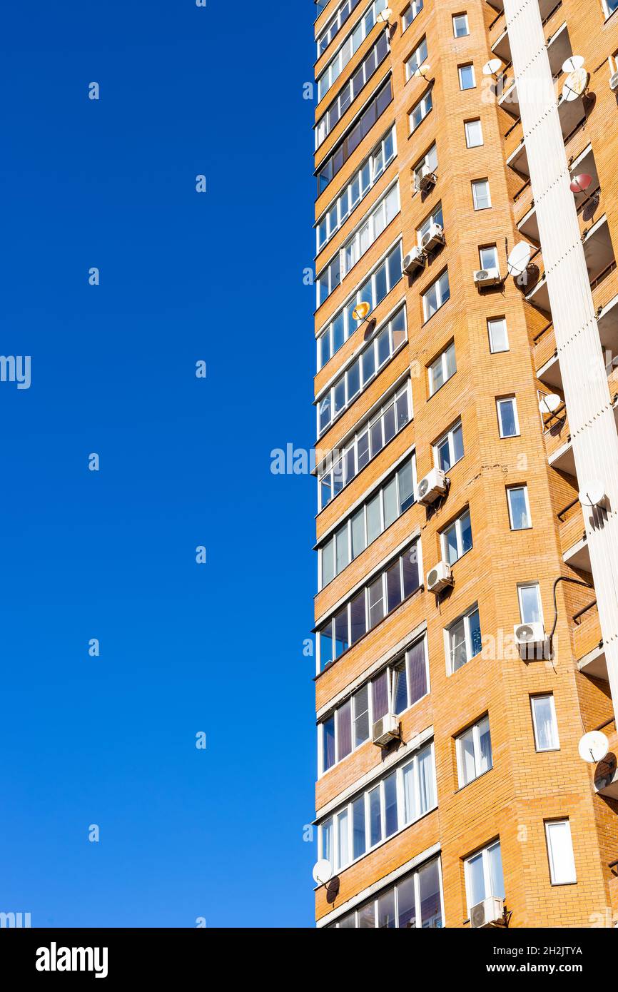 multi-storey brick apartment house and blue sky on sunny day Stock ...