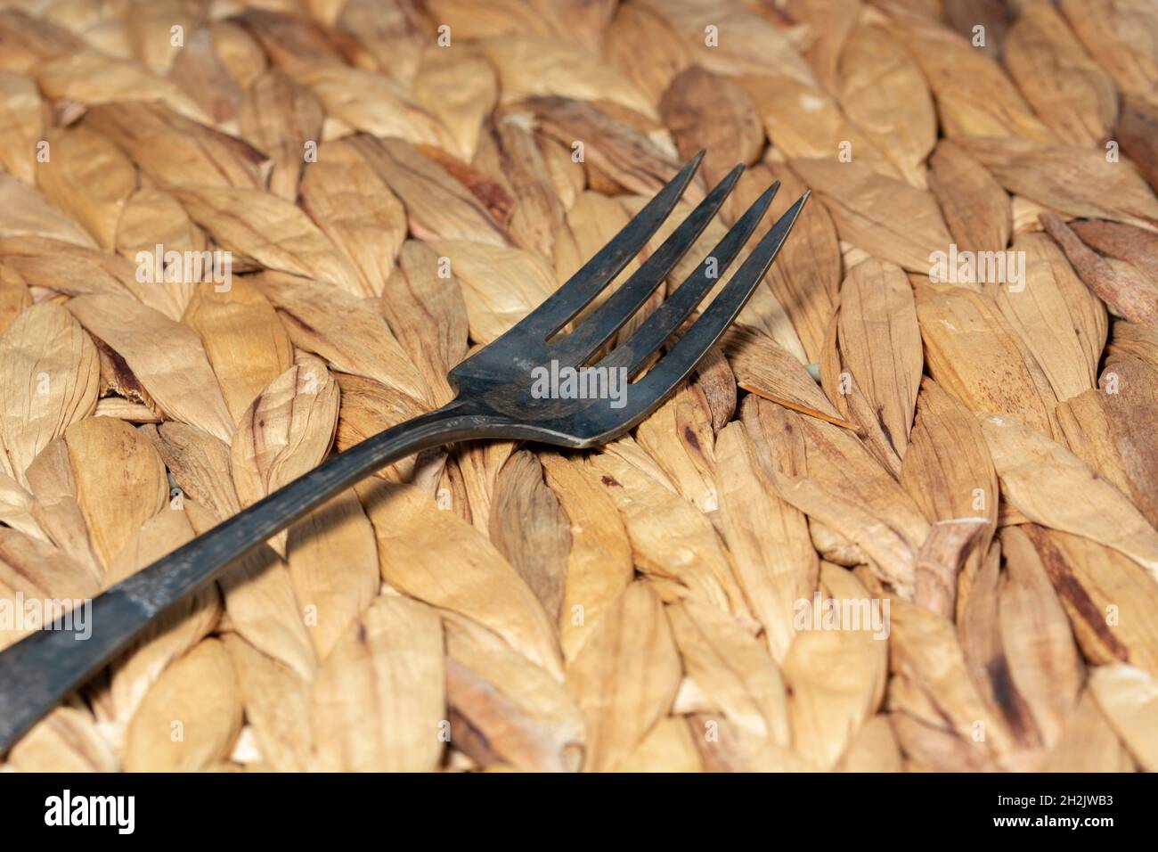 old fork on wicker floor Stock Photo - Alamy