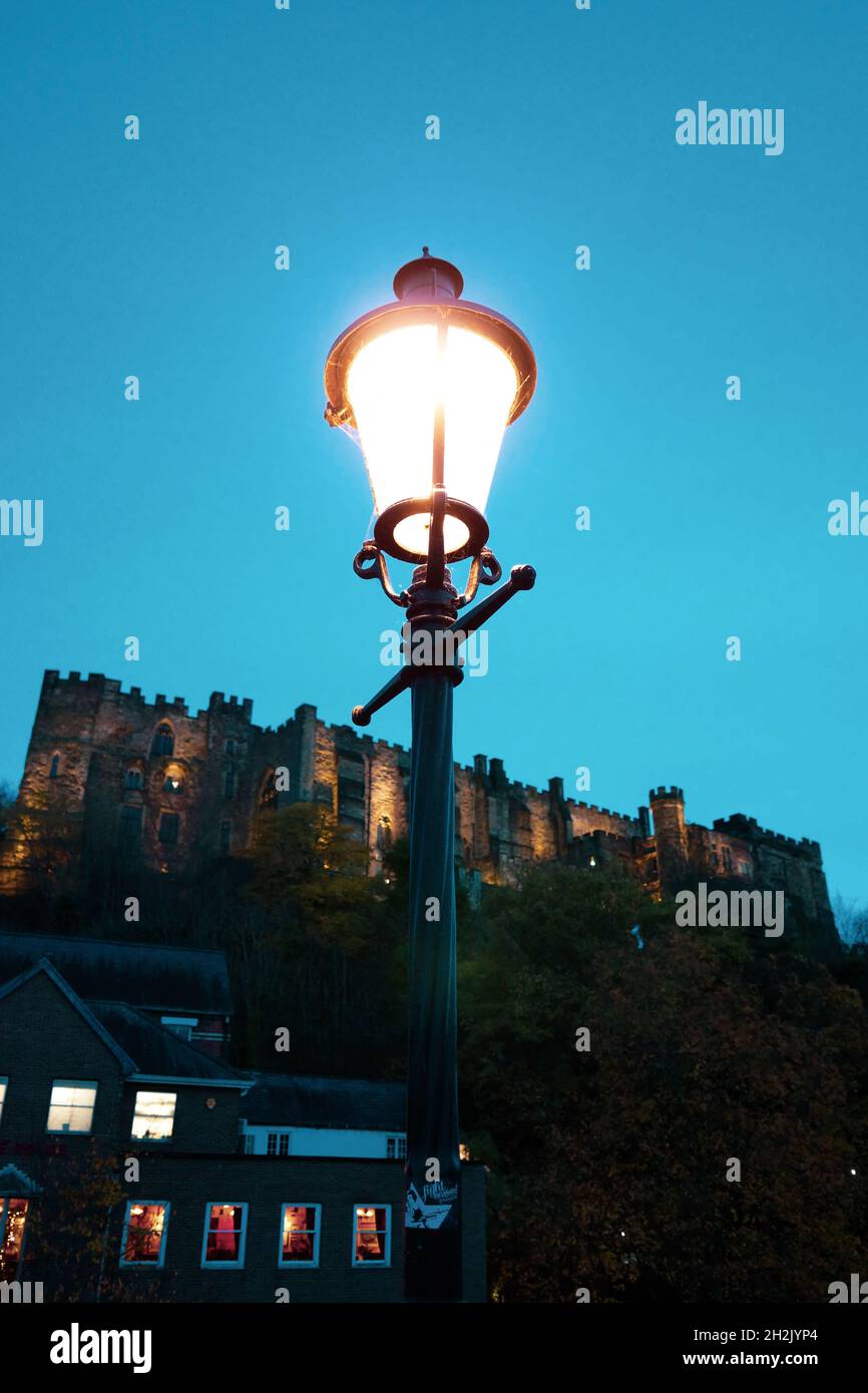 An old lamp post on Framwellgate Bridge in evening with Durham Castle ...