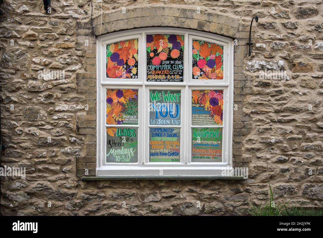 Colourful window advertisements/display at the Settle Hub in Commercial ...