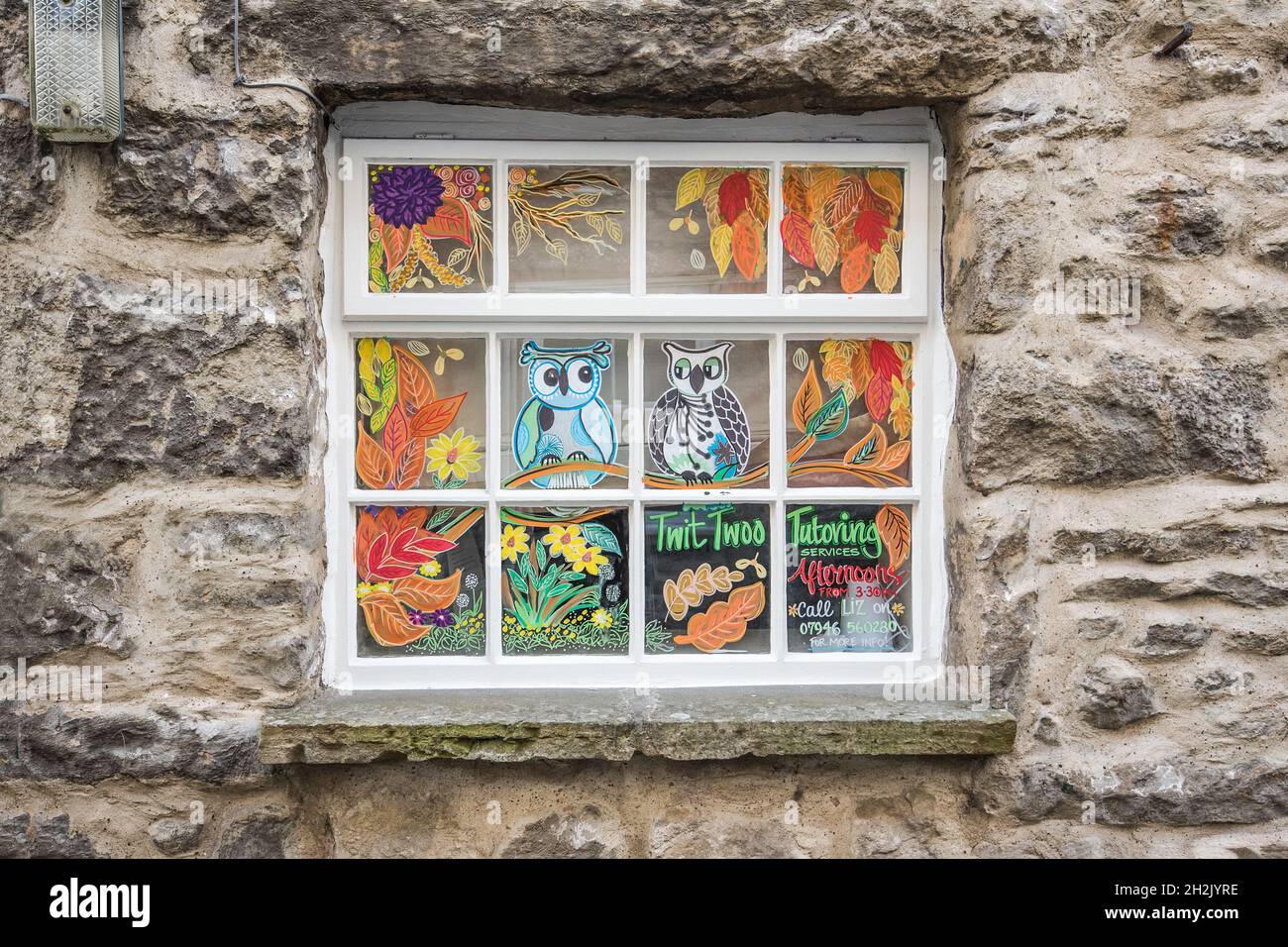 Colourful window advertisements/display at the Settle Hub in Commercial ...