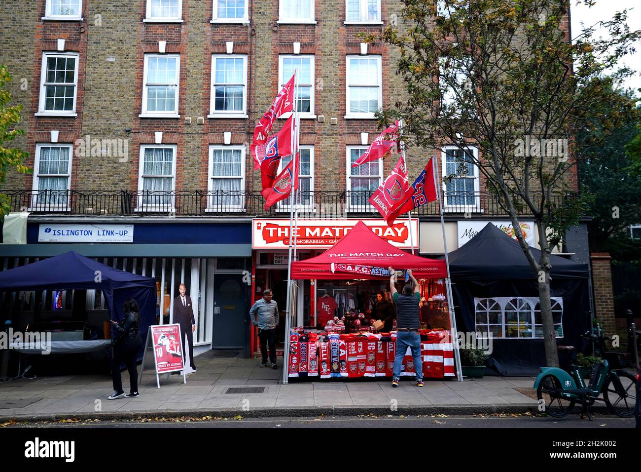 Street vendors set up their merchandise stall ahead of the Premier ...