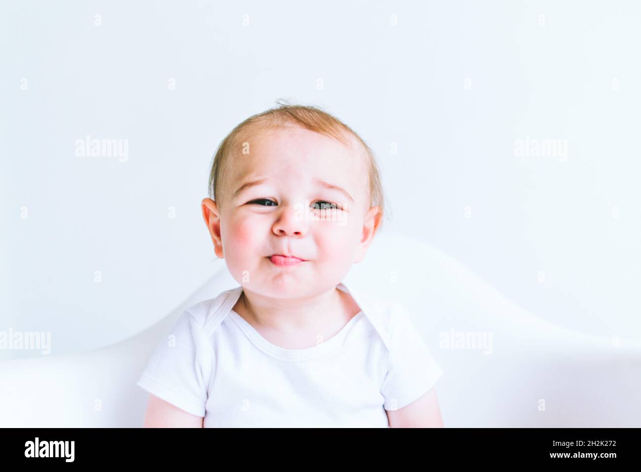 Closeup of a baby boy making a silly face Stock Photo - Alamy