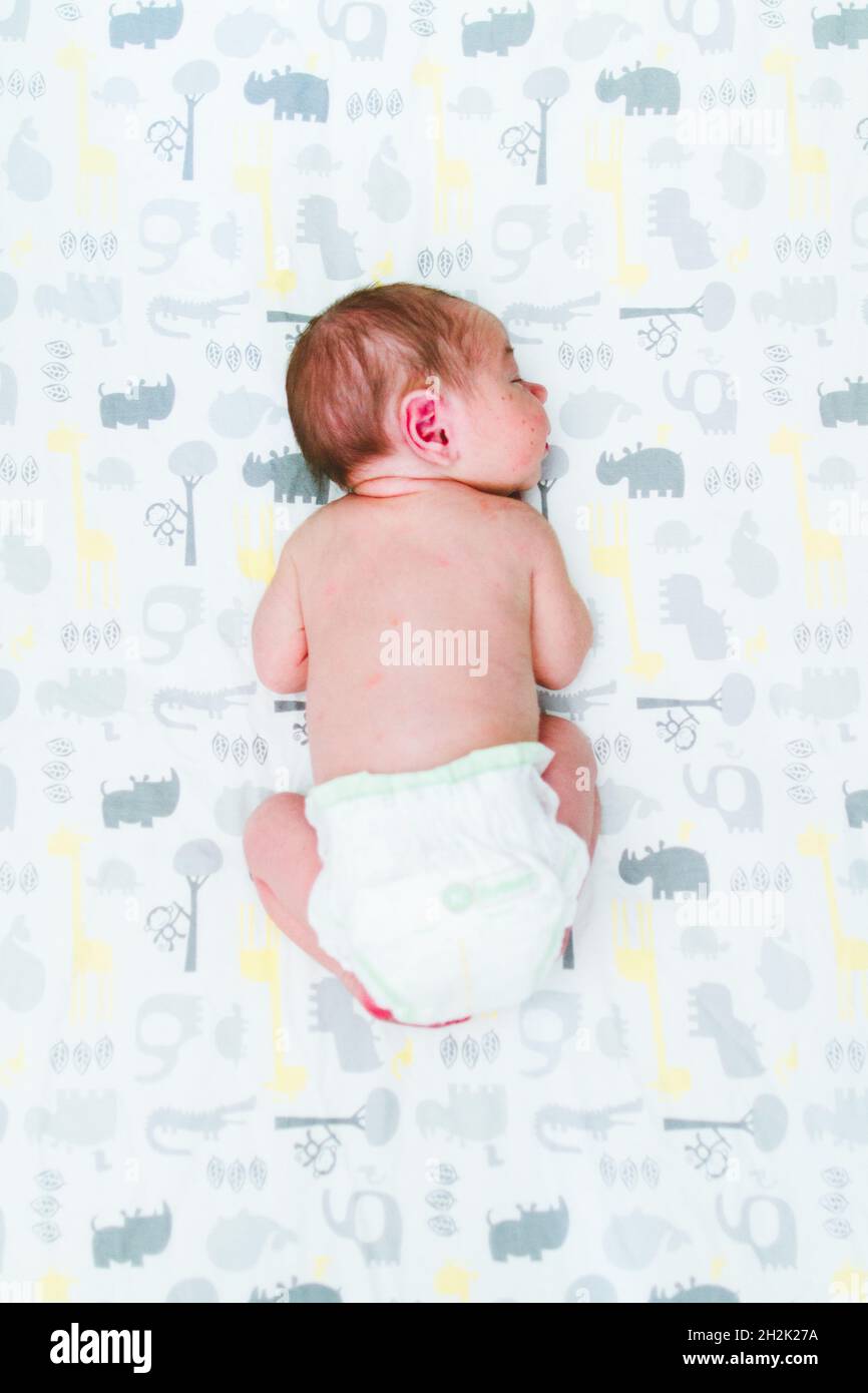 Above view of a baby boy sleeping in a crib Stock Photo - Alamy