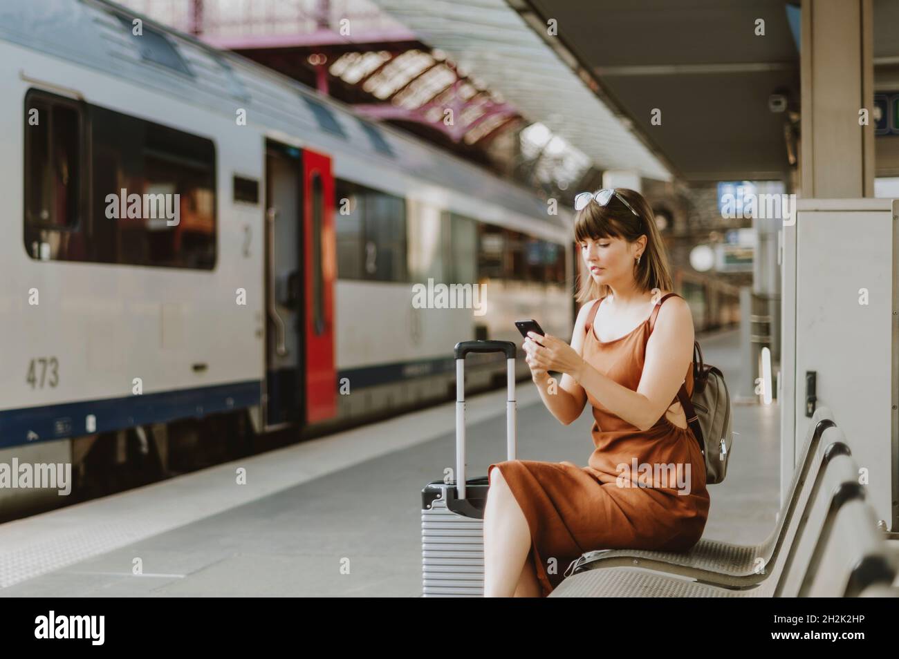 Woman waiting train hi-res stock photography and images - Alamy
