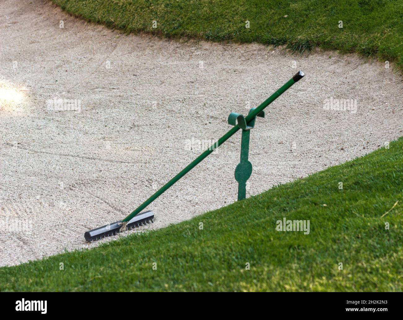 sand trap rake on the golf course Stock Photo - Alamy