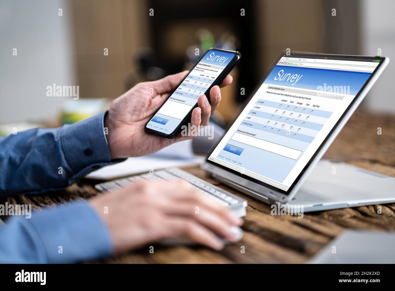 Businessman Giving Online Survey On Digital Tablet At Office Desk Stock ...