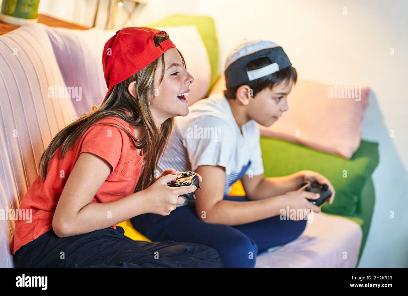 Children playing video games at home Stock Photo - Alamy