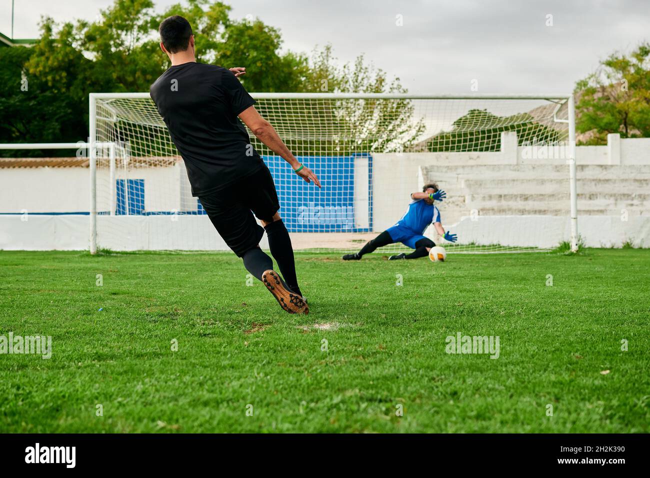 Goalkeeper saves goal football player hi-res stock photography and ...