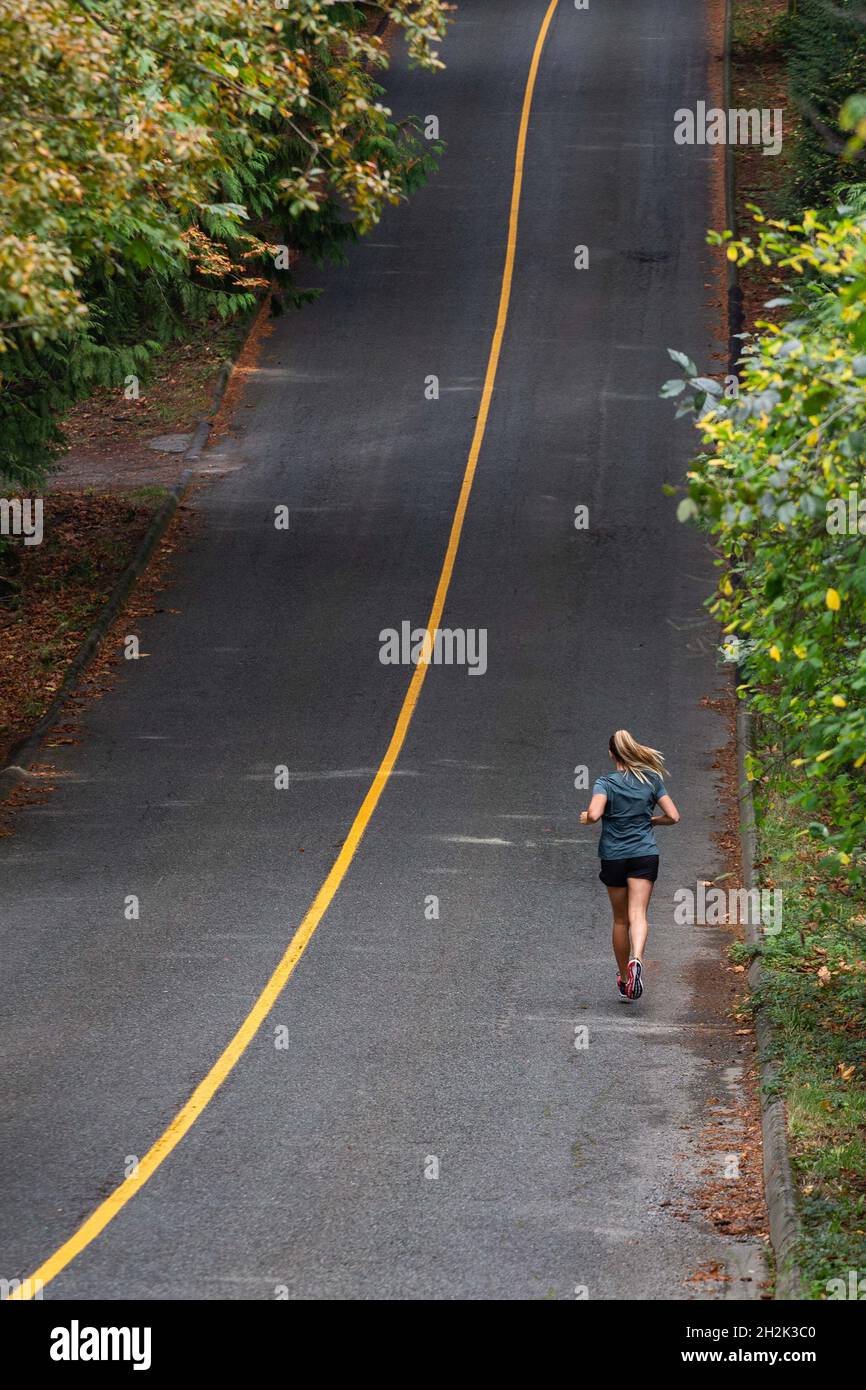 Female running hill up hi-res stock photography and images - Alamy