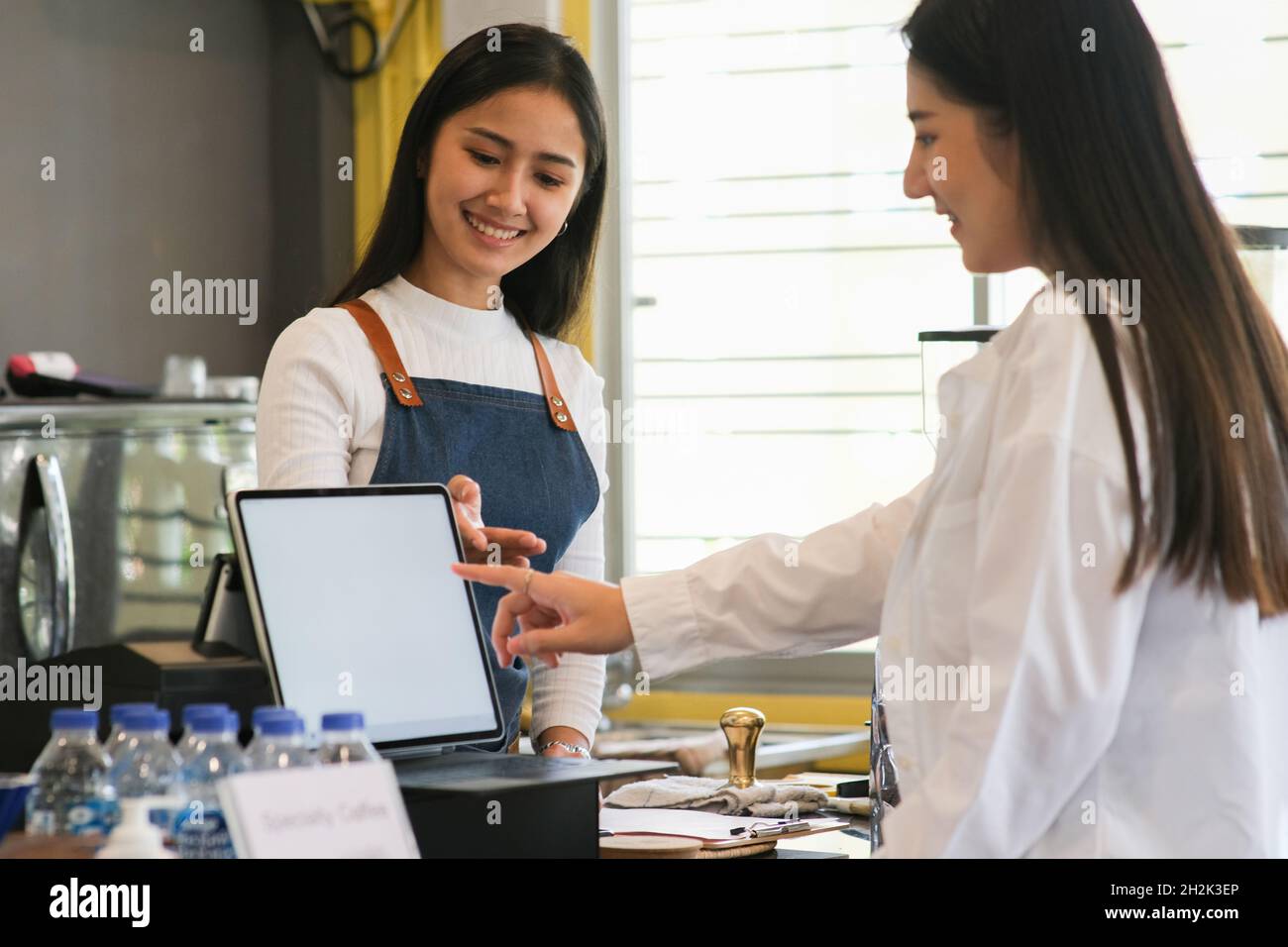 Customer self service order drink menu with tablet screen at cafe ...