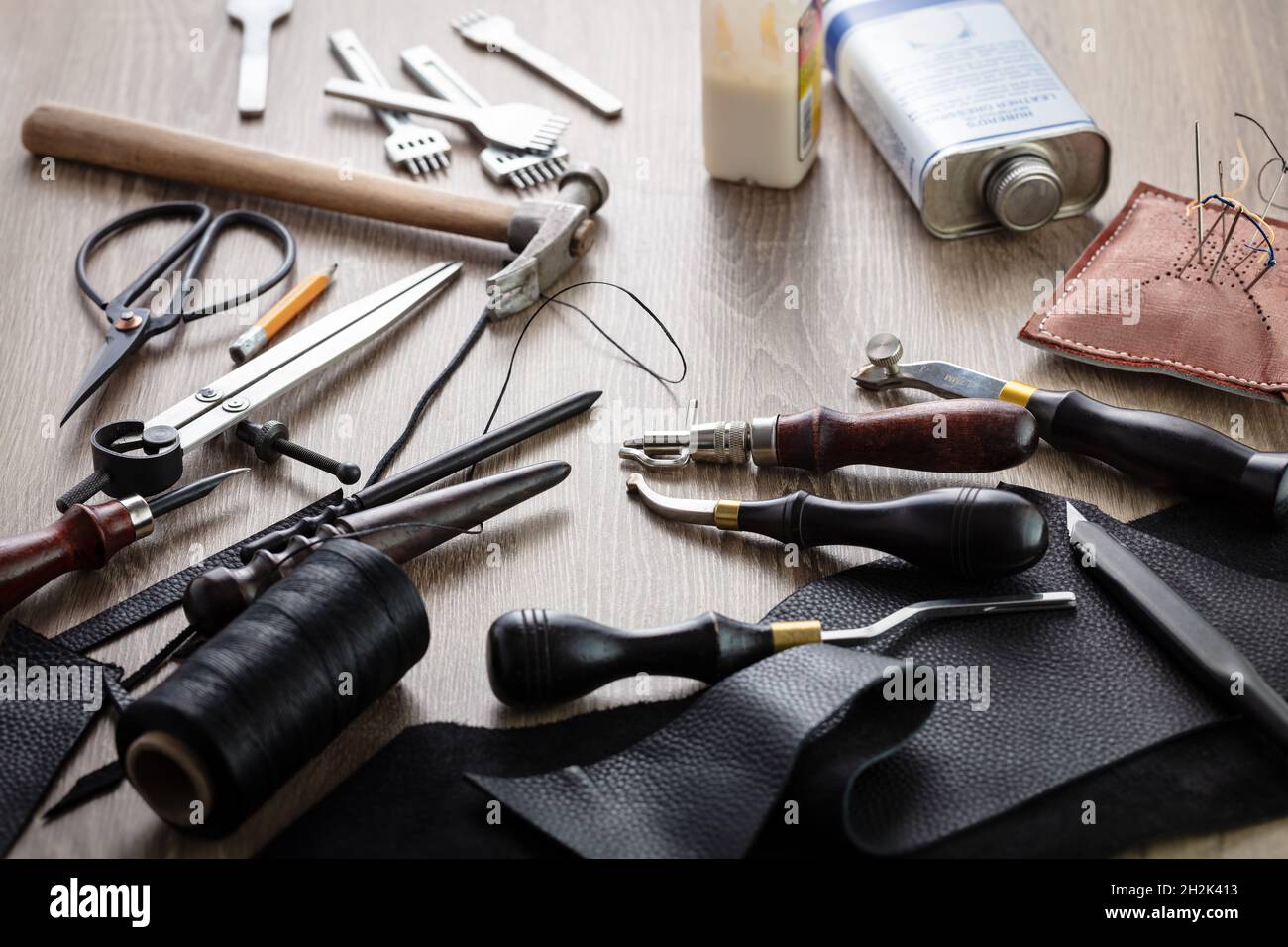 Concept of leather handcraft instruments. Working process Stock Photo ...