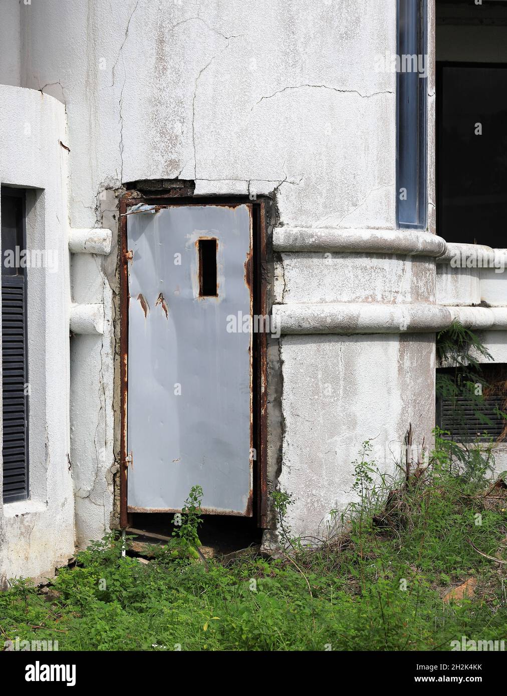 The decay metal gray back door of abandoned building Stock Photo - Alamy