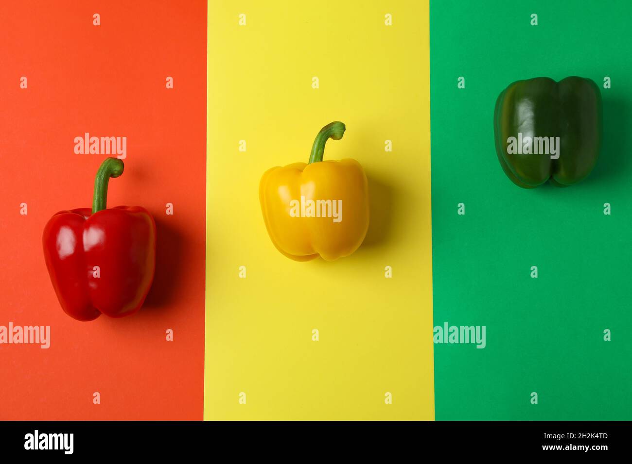 Multi-colored bell pepper on multicolored background Stock Photo - Alamy