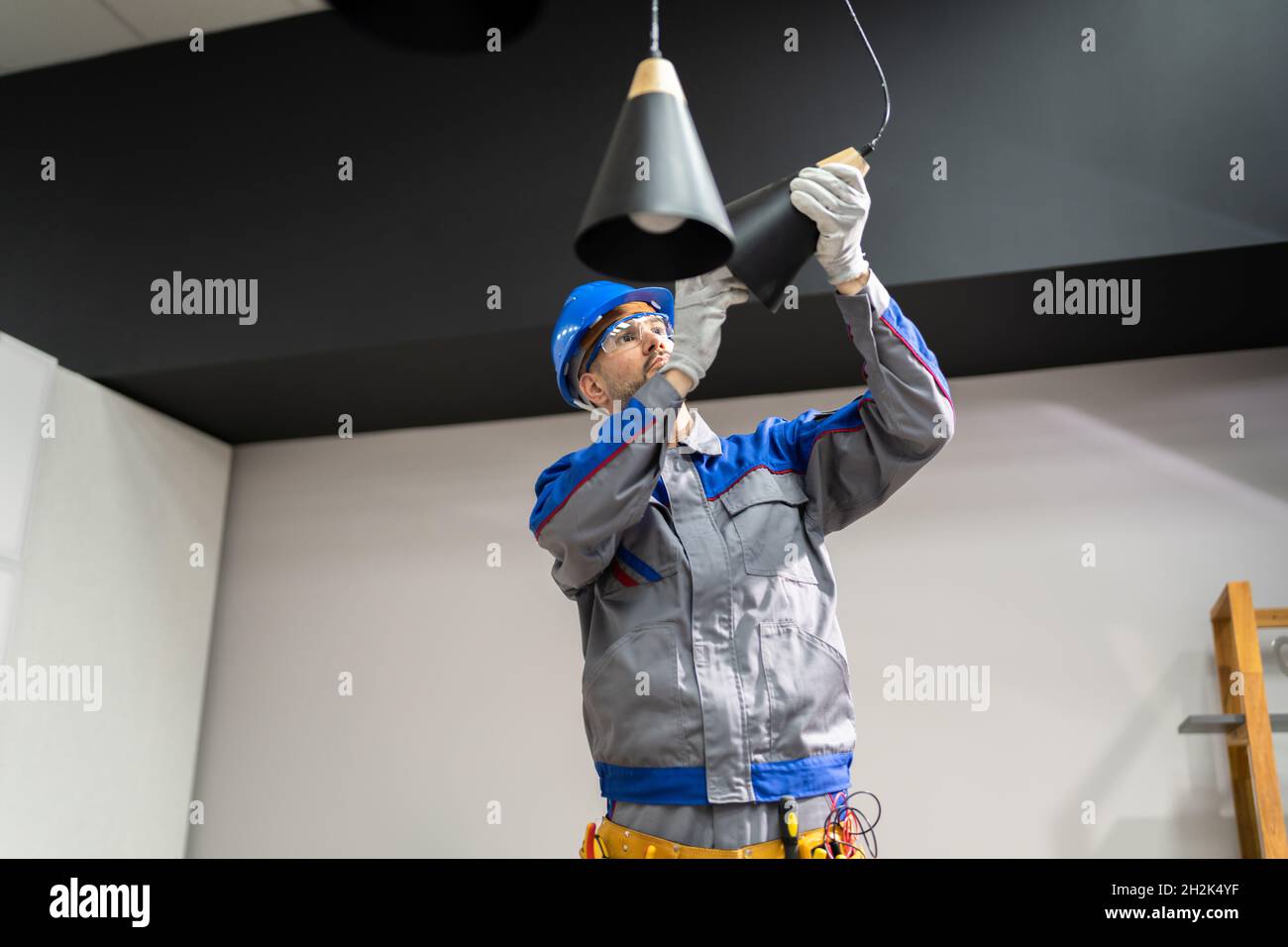 Home Ceiling Light Equipment Maintenance. Professional Electrician ...