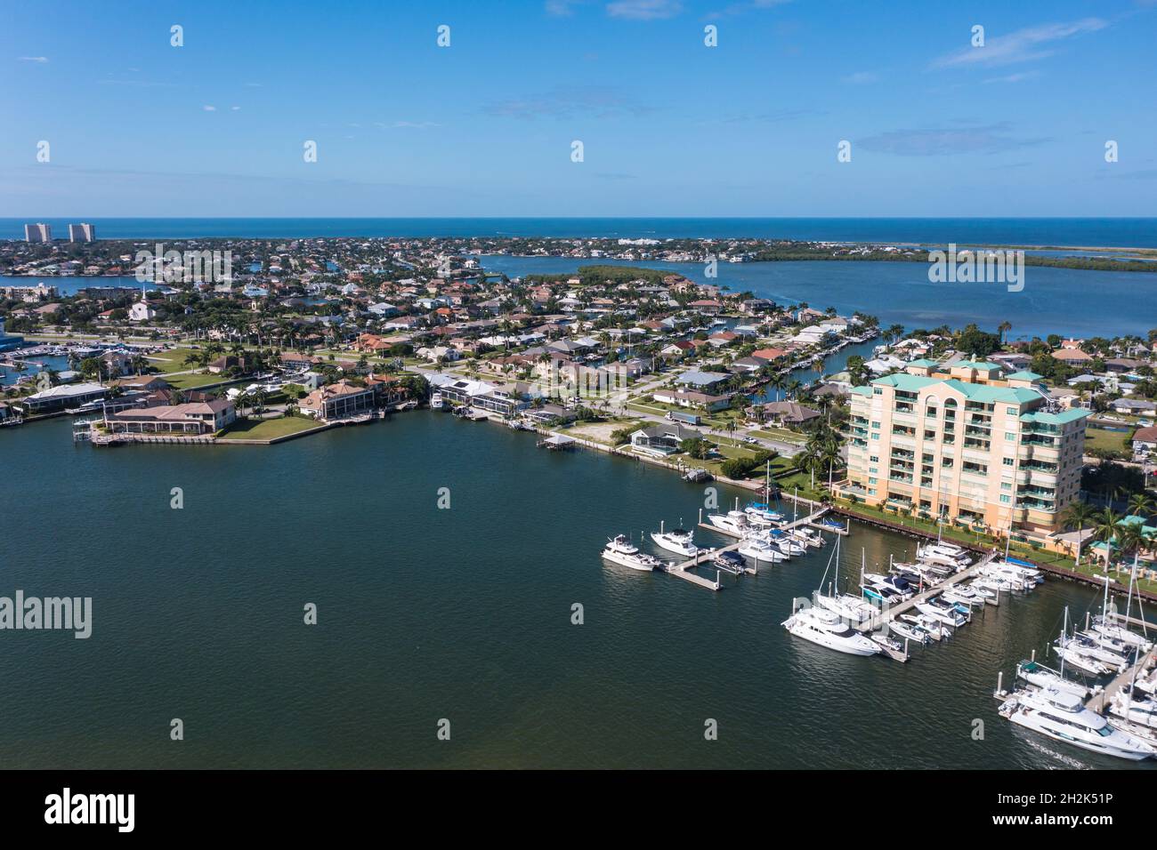 Marco Island hotels next to blue water and beautiful sky in background ...
