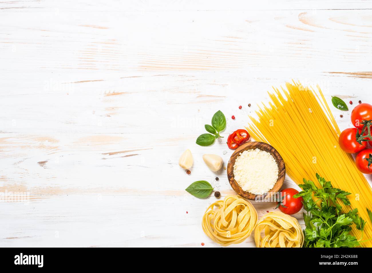 Italian food background at white bkitchen table Stock Photo - Alamy