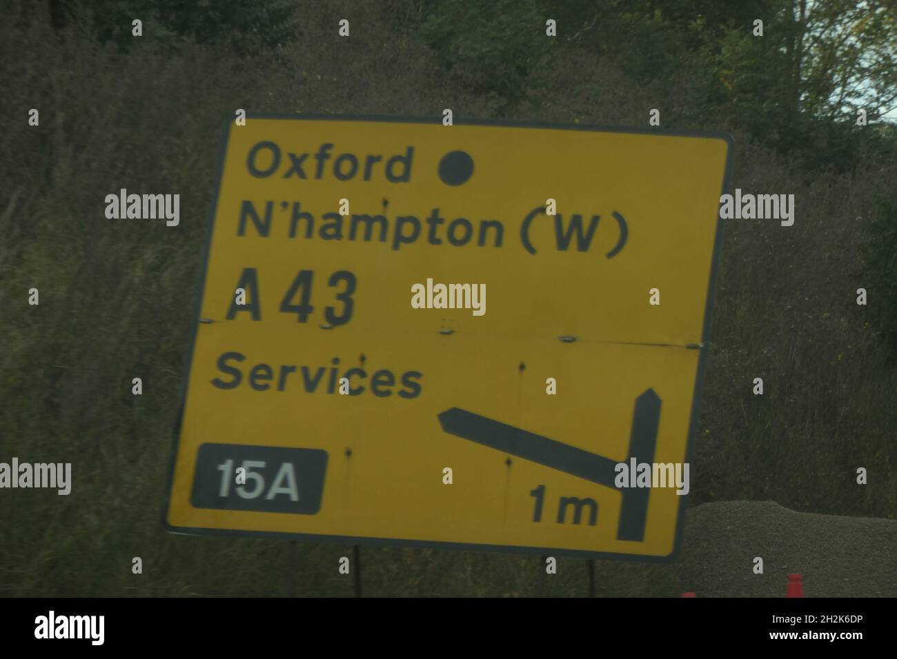 Road sign to Northampton at Junction 15A and service station services ...