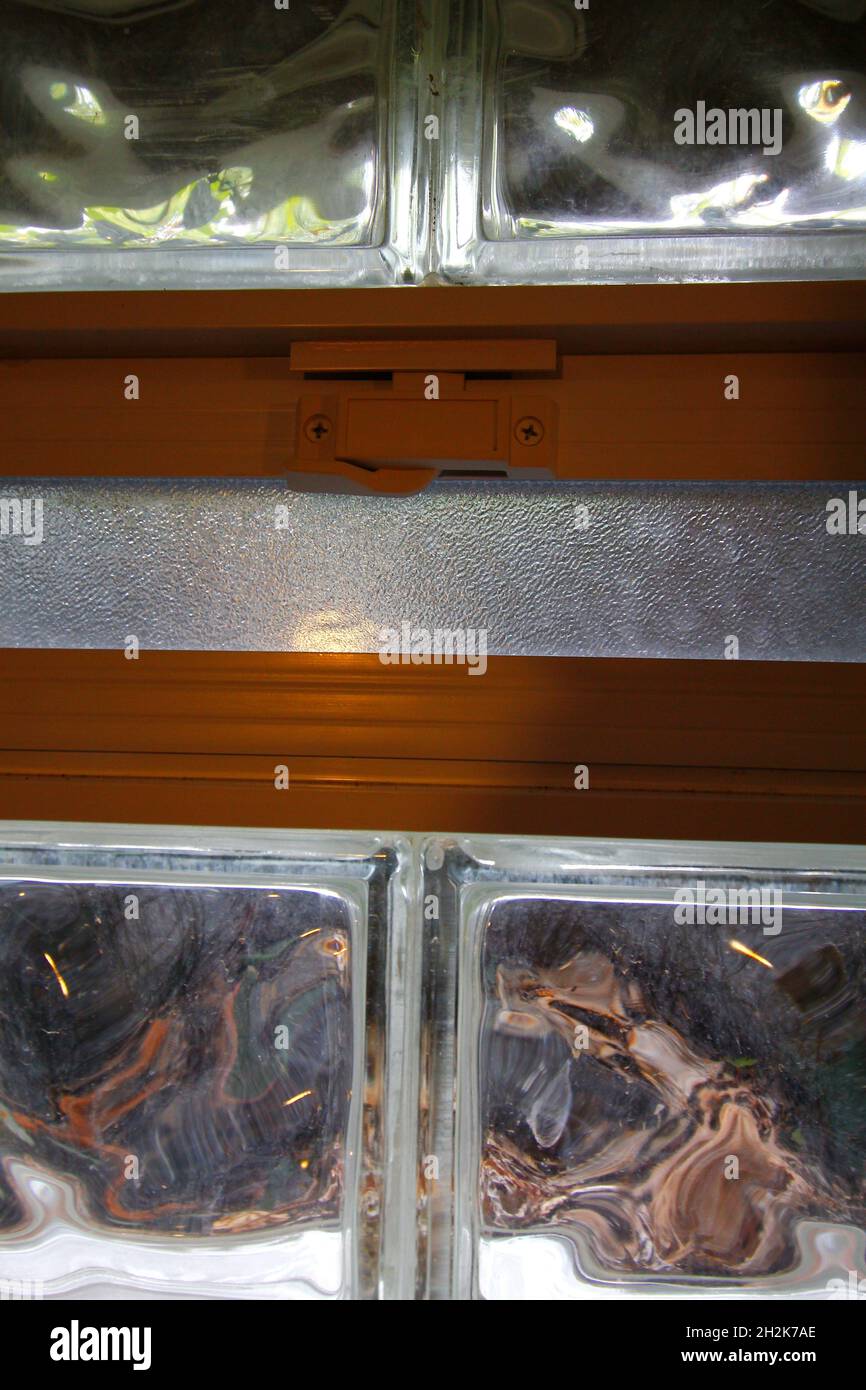 Glass block window with air vent in a basement Stock Photo - Alamy