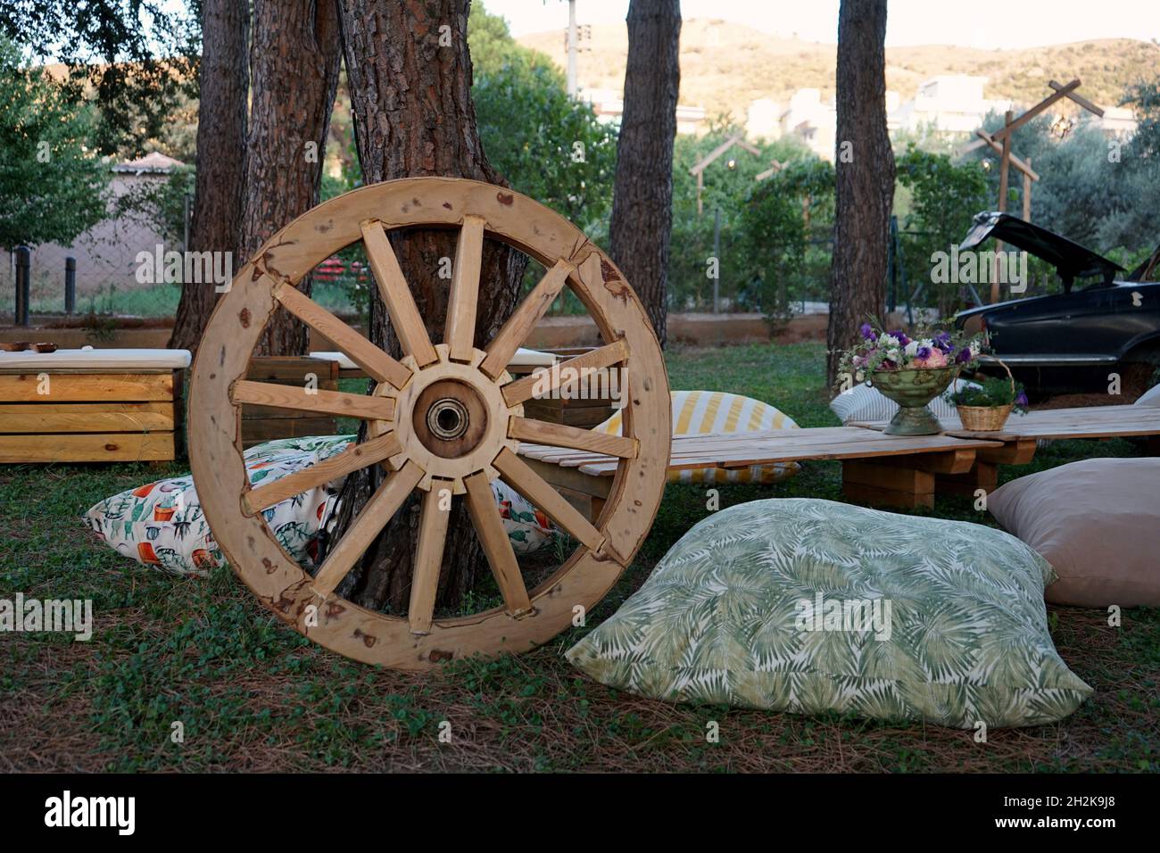 Wooden wheel decoration in the park Stock Photo - Alamy