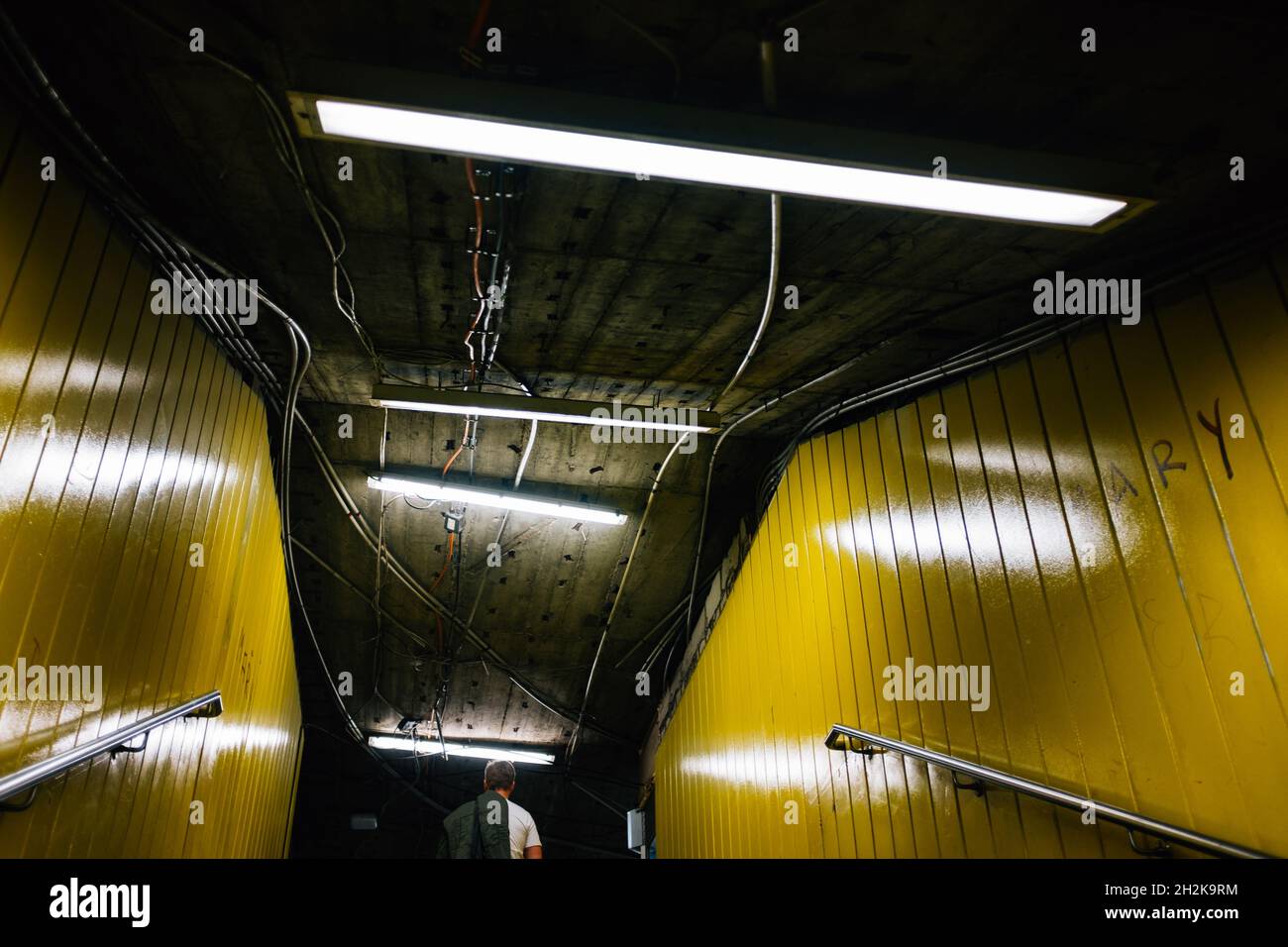 Underground passage ceiling with electric cables Stock Photo - Alamy